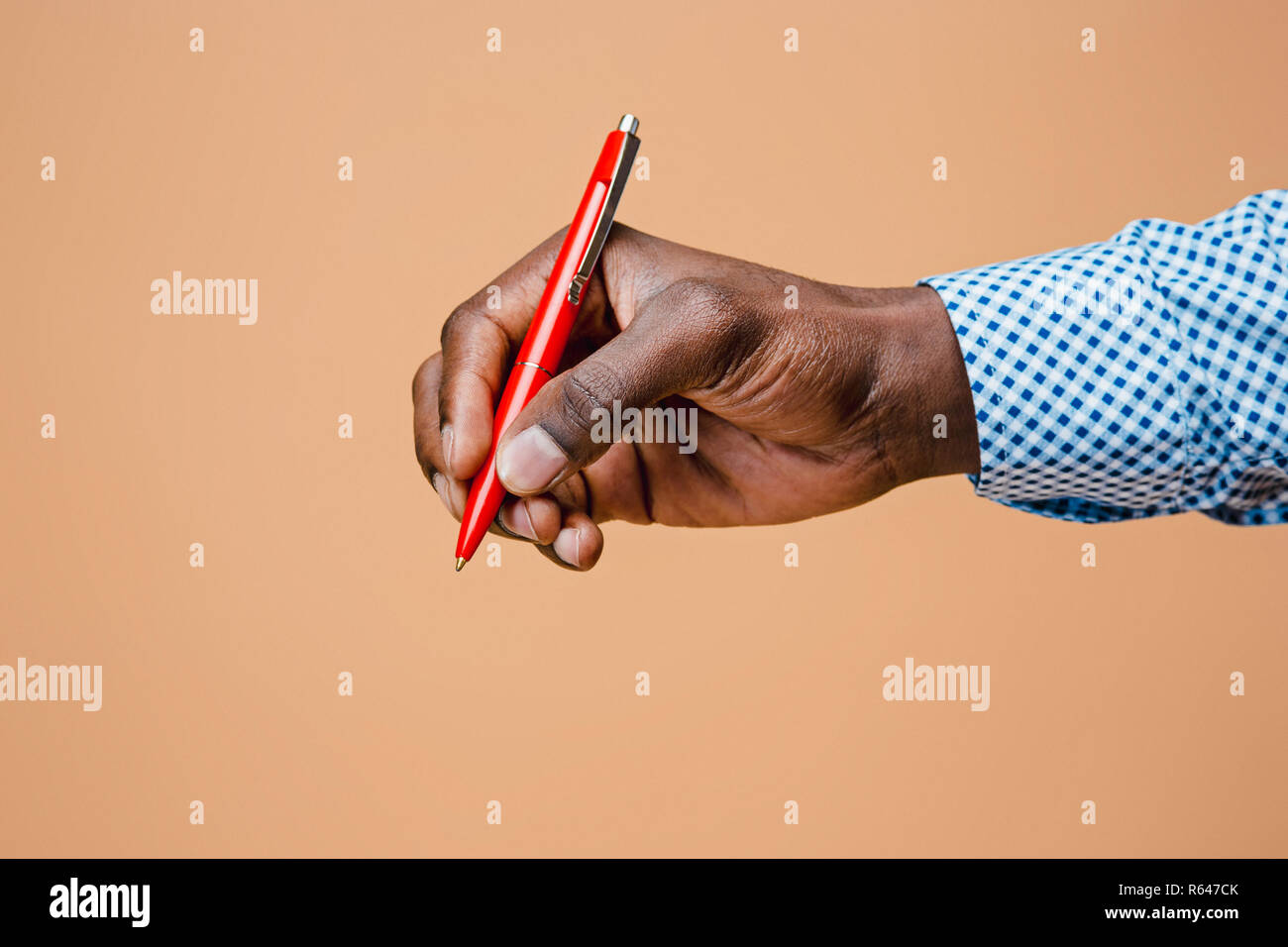 Male hand holding pencil, isolated Stock Photo - Alamy