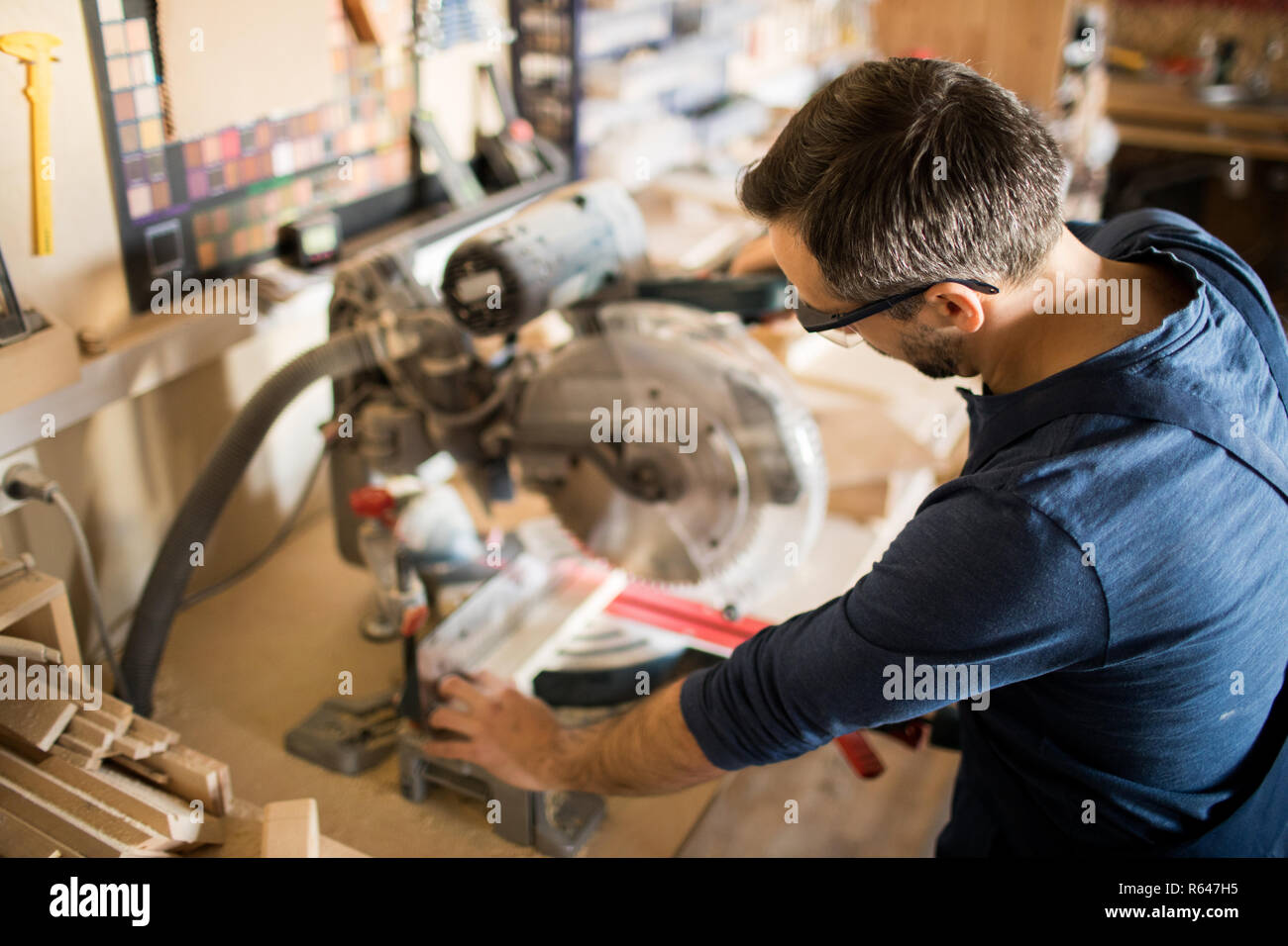 Worker Cutting Wood Stock Photo - Alamy
