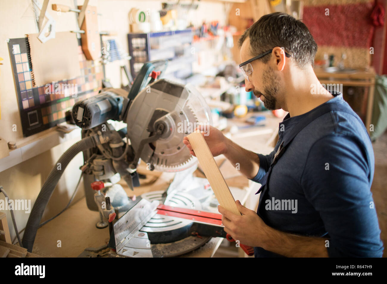 Carpenter Inspecting Materials Stock Photo - Alamy