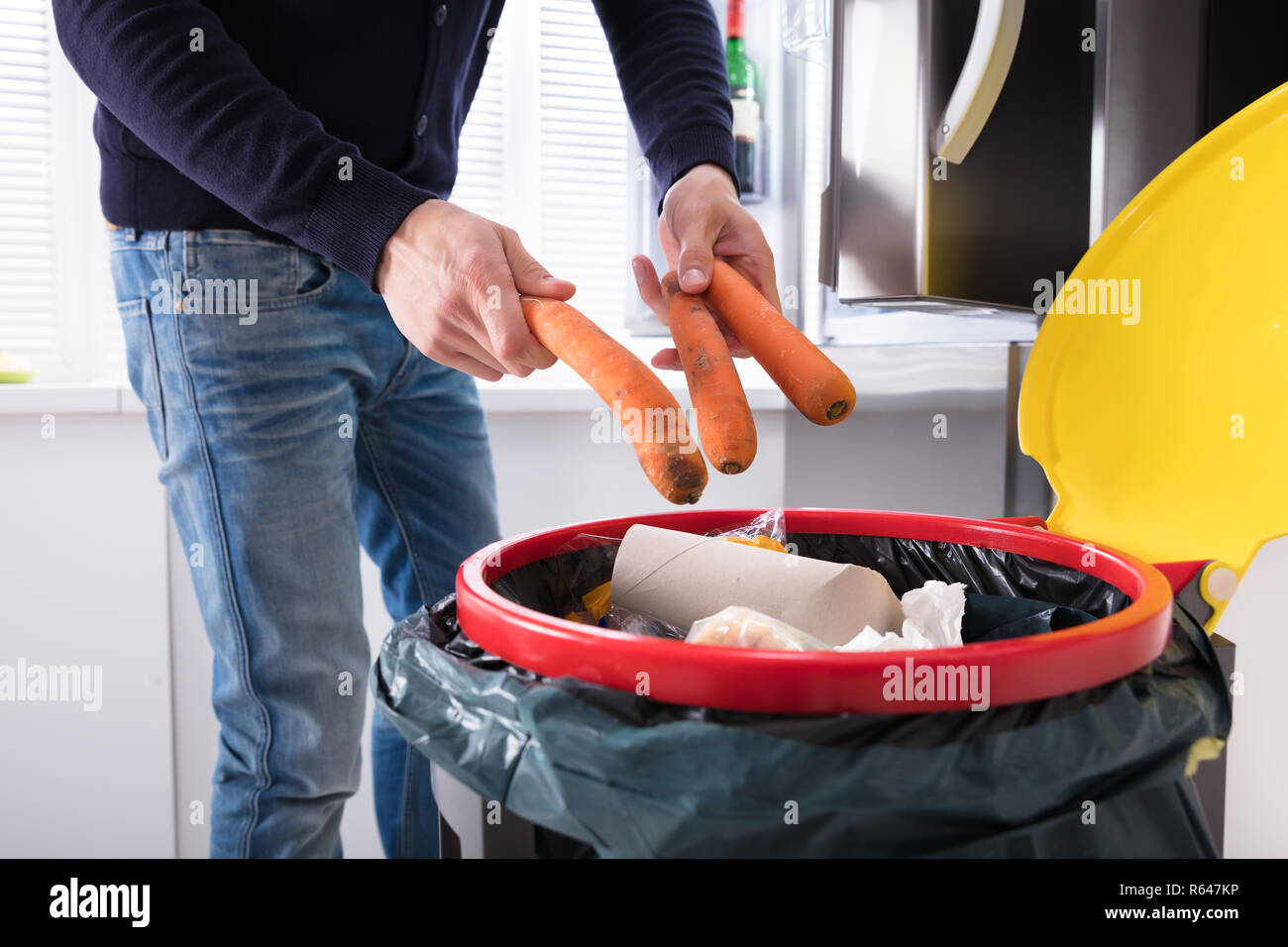 Man throwing food in bin hi-res stock photography and images - Alamy