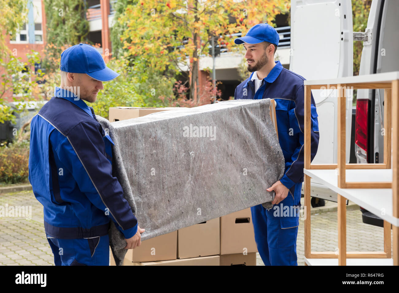 Workers teamwork working together men unloading truck hi-res stock ...