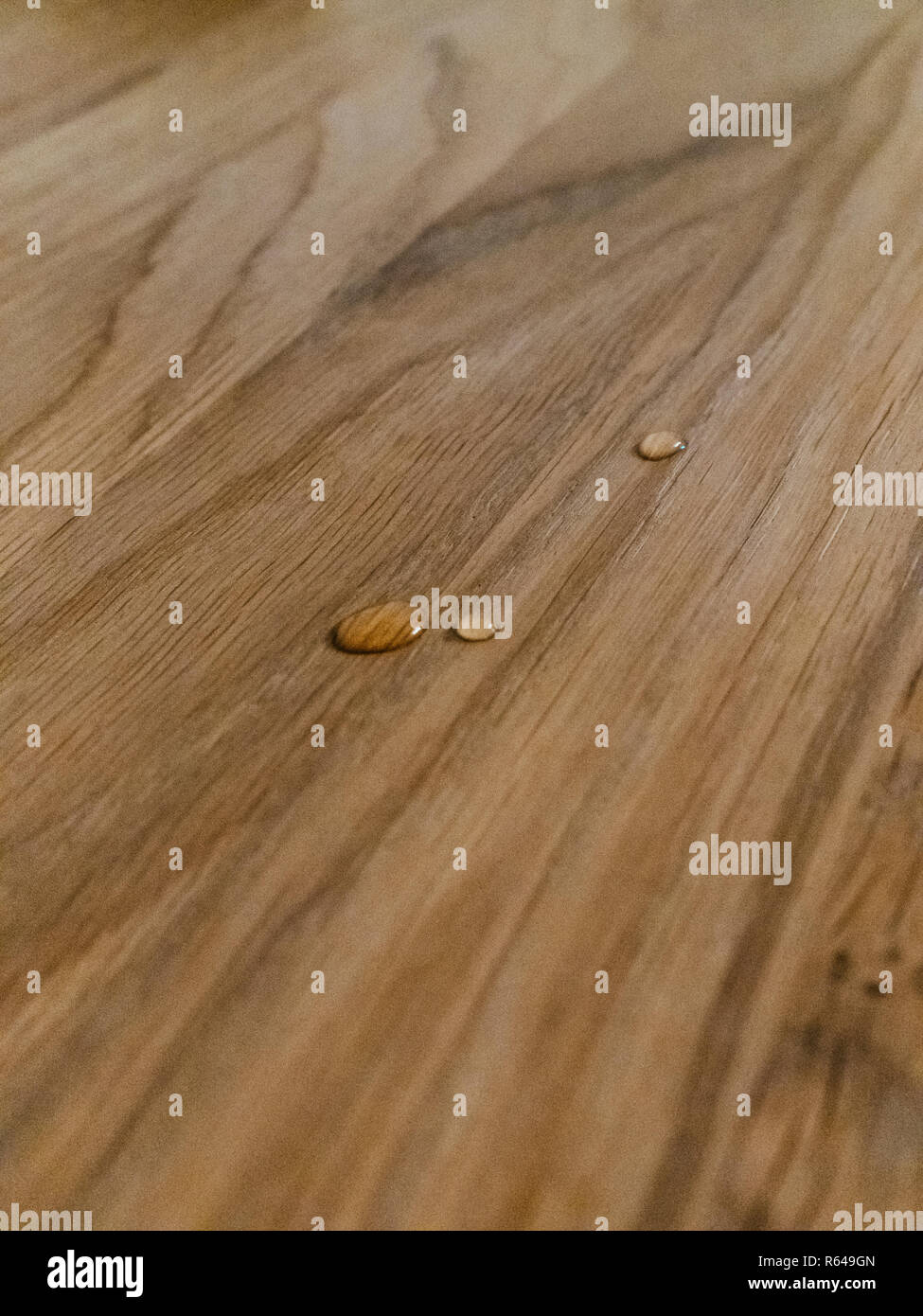 Water drops on natural wood table top Stock Photo - Alamy