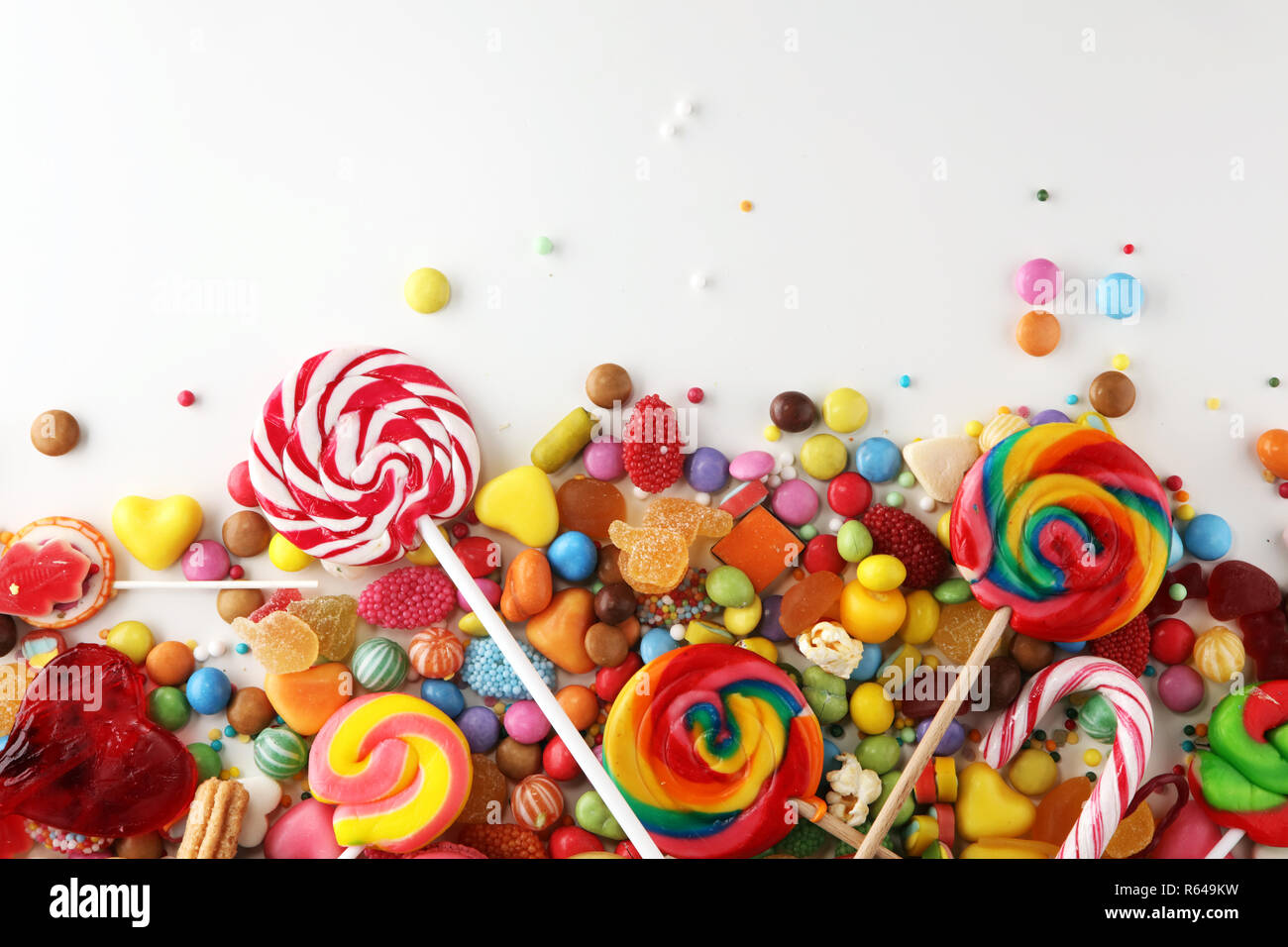 candies with jelly and sugar. colorful array of different childs sweets ...