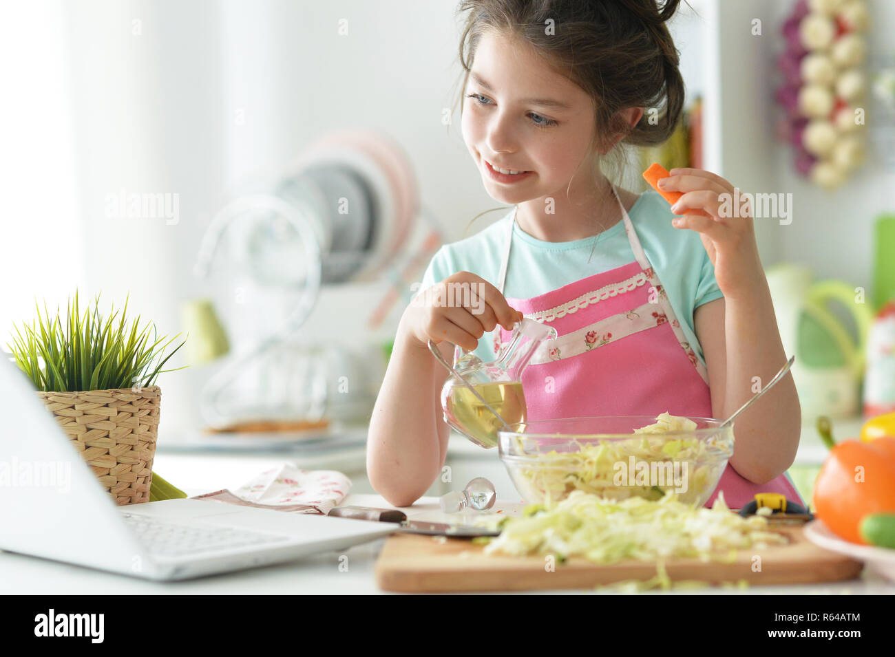 Portrait of girl cook to eat in the kitchen Stock Photo - Alamy