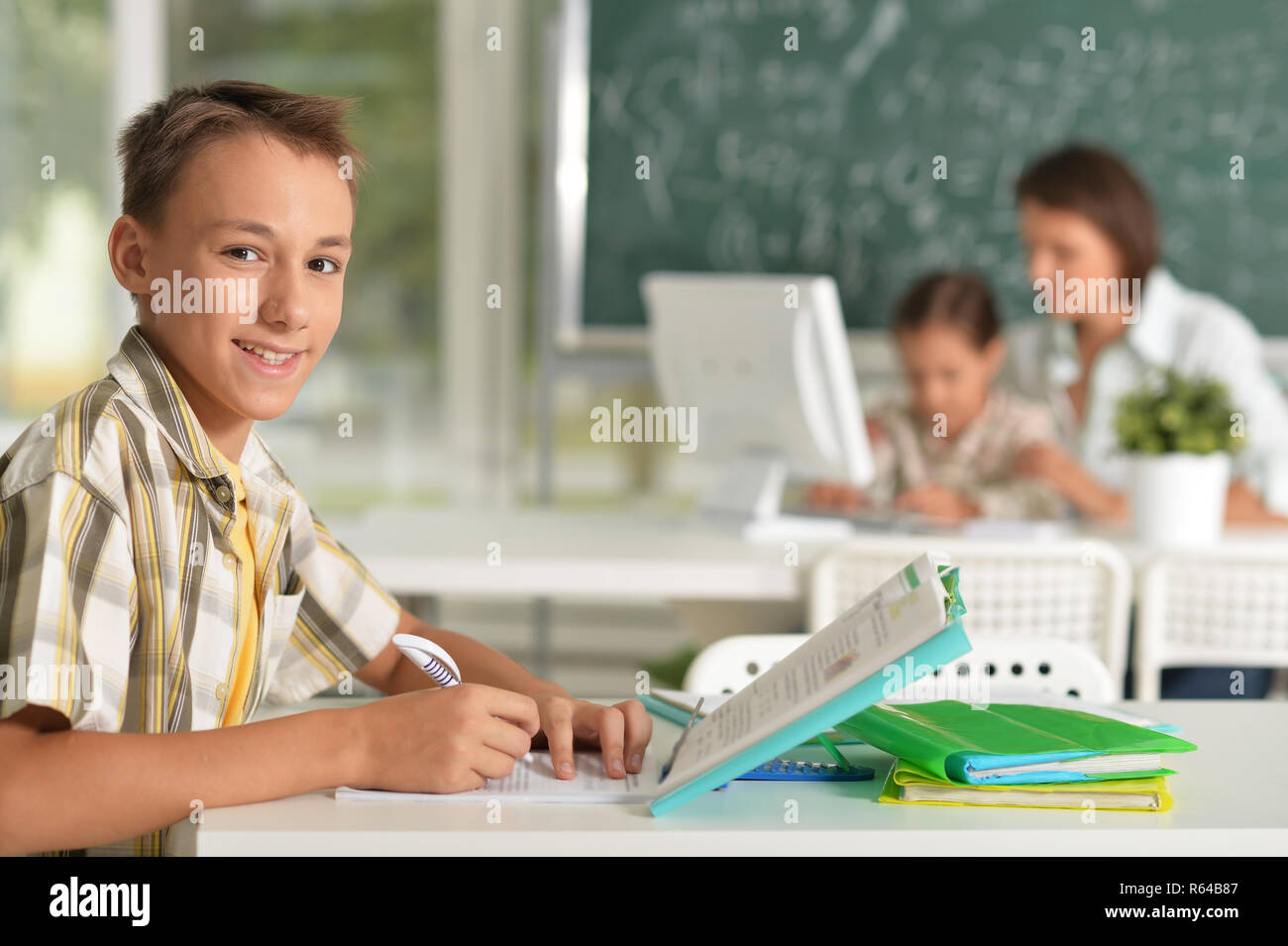 Portrait of children at school in the classroom Stock Photo - Alamy