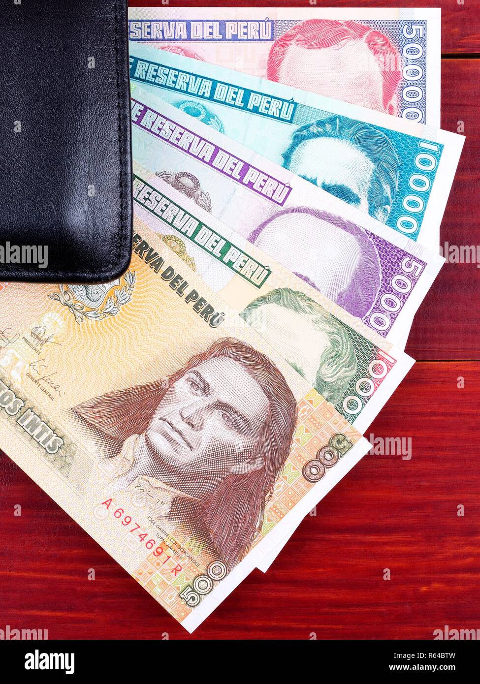 Old Peruvian money in the black wallet Stock Photo - Alamy