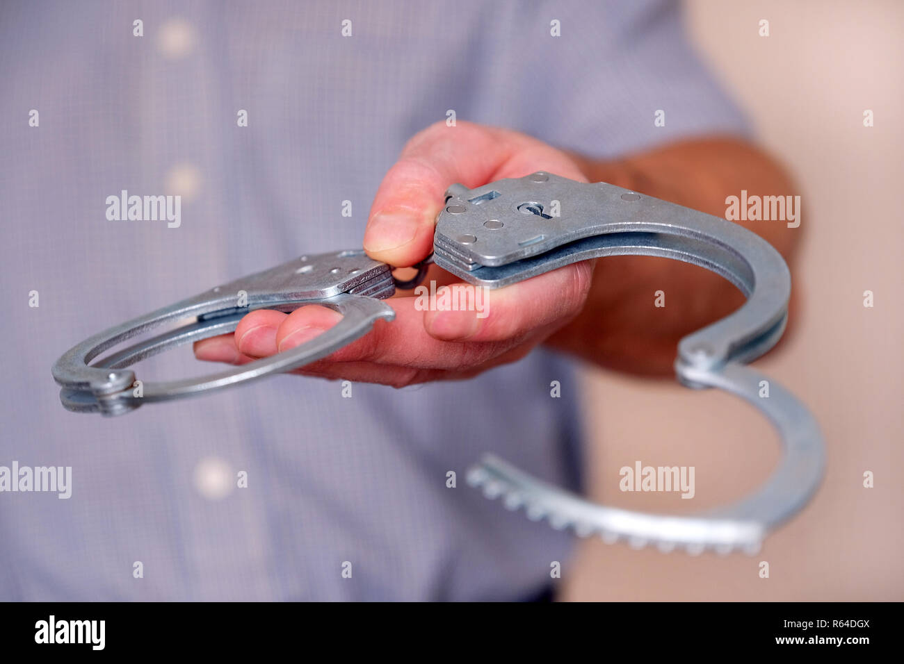 Open handcuffs hi-res stock photography and images - Alamy