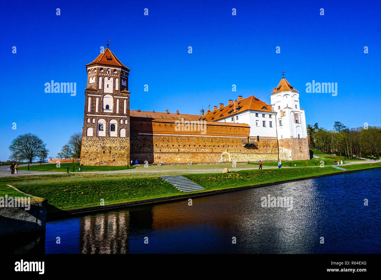 Mir Castle Complex Side View with Dark Blue Lake and Picturesque Sky ...
