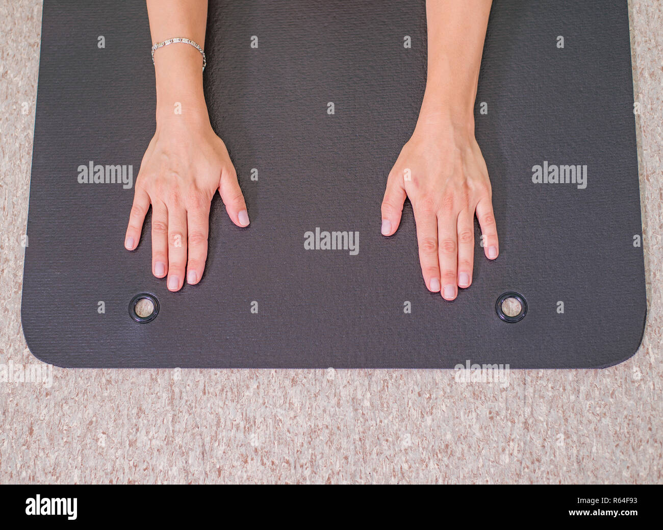 Top view at hands on mat Stock Photo - Alamy