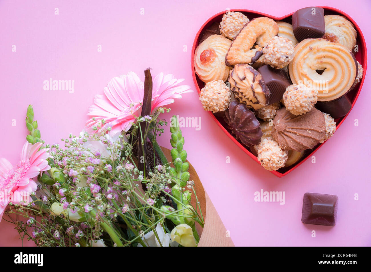 Heart shaped box with cookies and flowers Stock Photo - Alamy