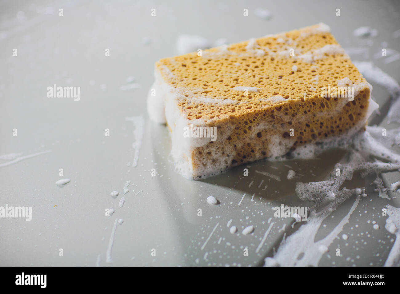 sponge over car for washing Stock Photo - Alamy
