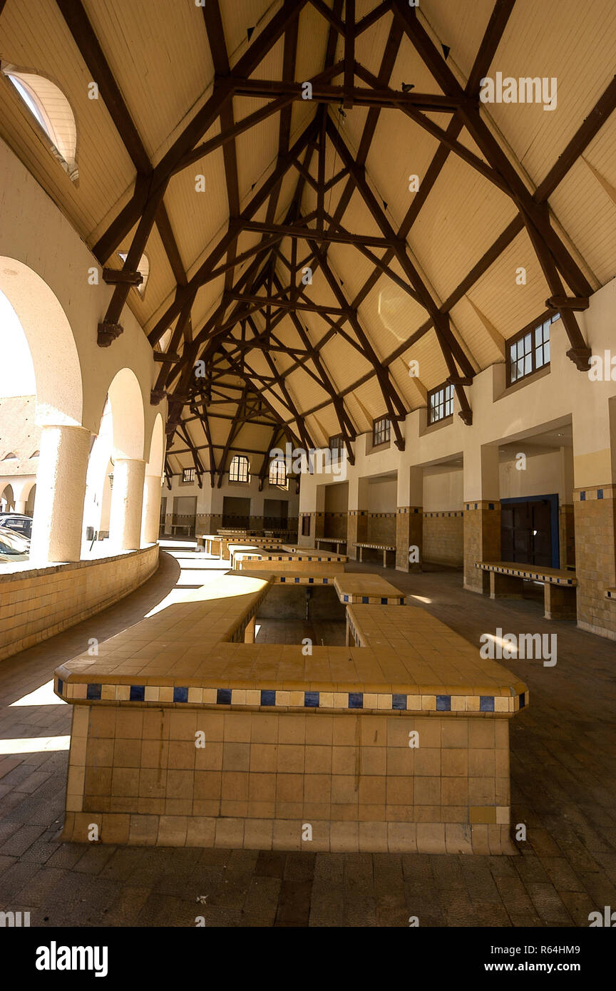 The high raised ceiling with large open arch windows of the fish market ...