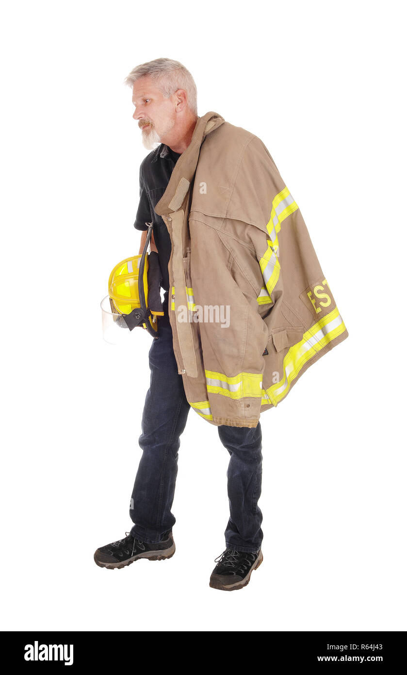 A firefighter standing in profile Stock Photo - Alamy