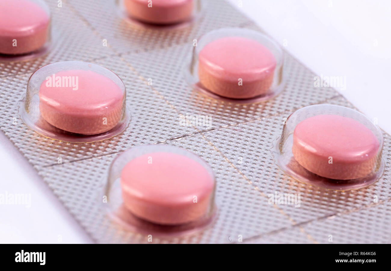 Pink pills in silver plastic pack - blister. Global pharmaceutical ...