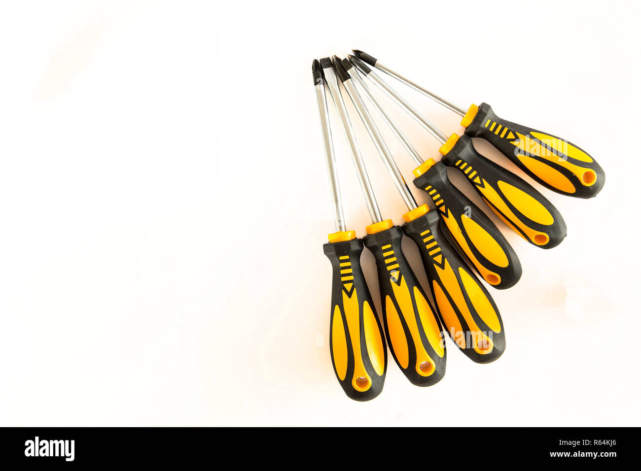 Set of screwdrivers with rubber black and yellow handles isolated on a ...