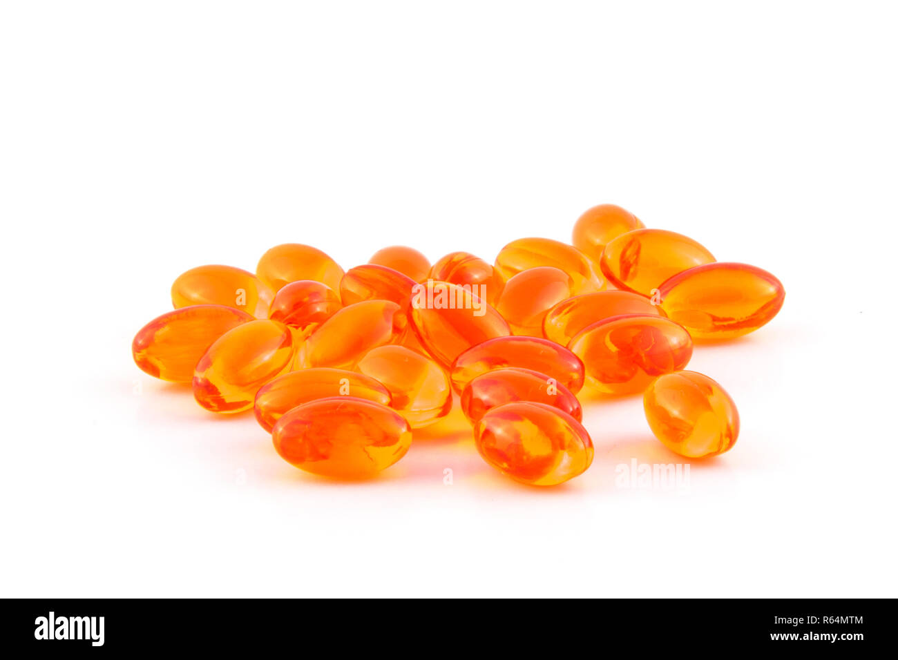 orange dha pill heap isolated on white background Stock Photo - Alamy