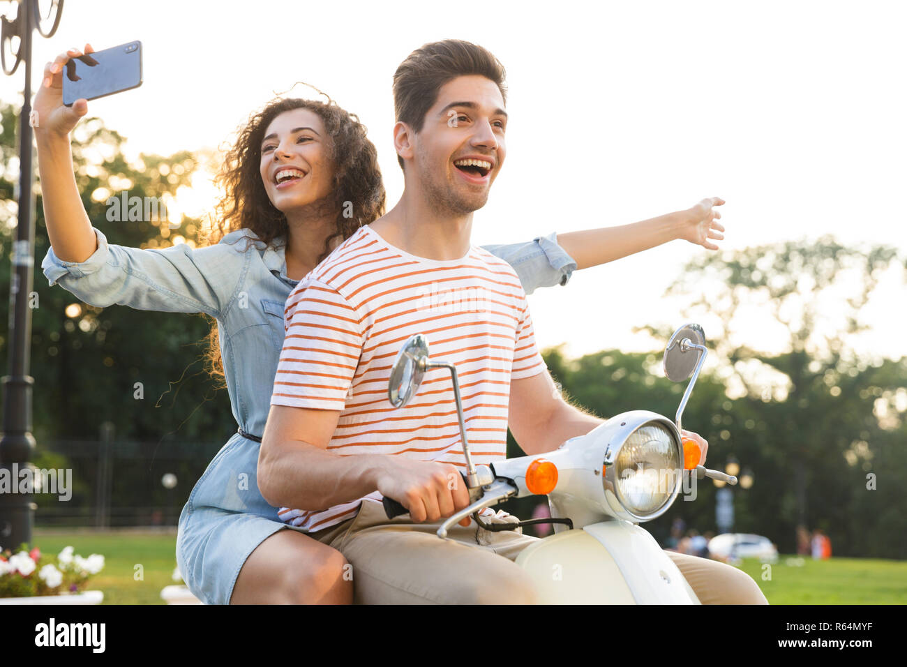 Portrait Of Lovely Woman Taking Selfie On Smartphone While Riding On