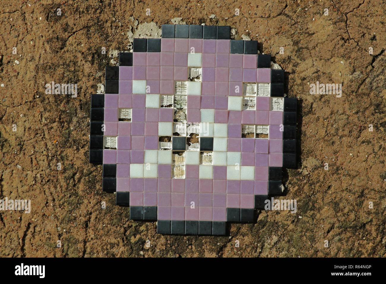 Invader or space invader art street mosaic on a wall above the Spanish ...
