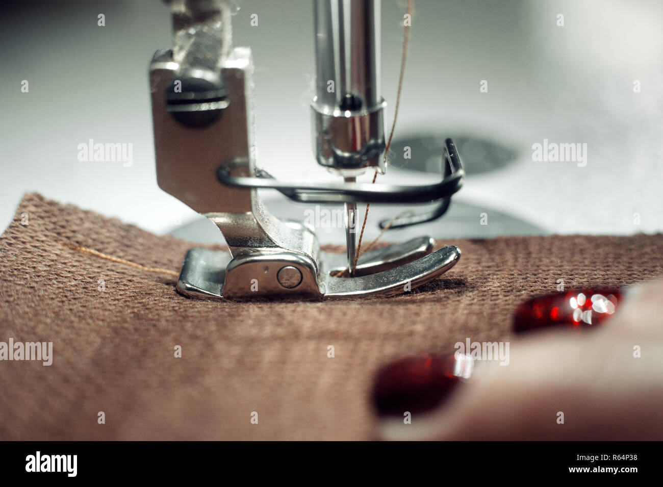 The sewing machine and item of clothing Stock Photo - Alamy