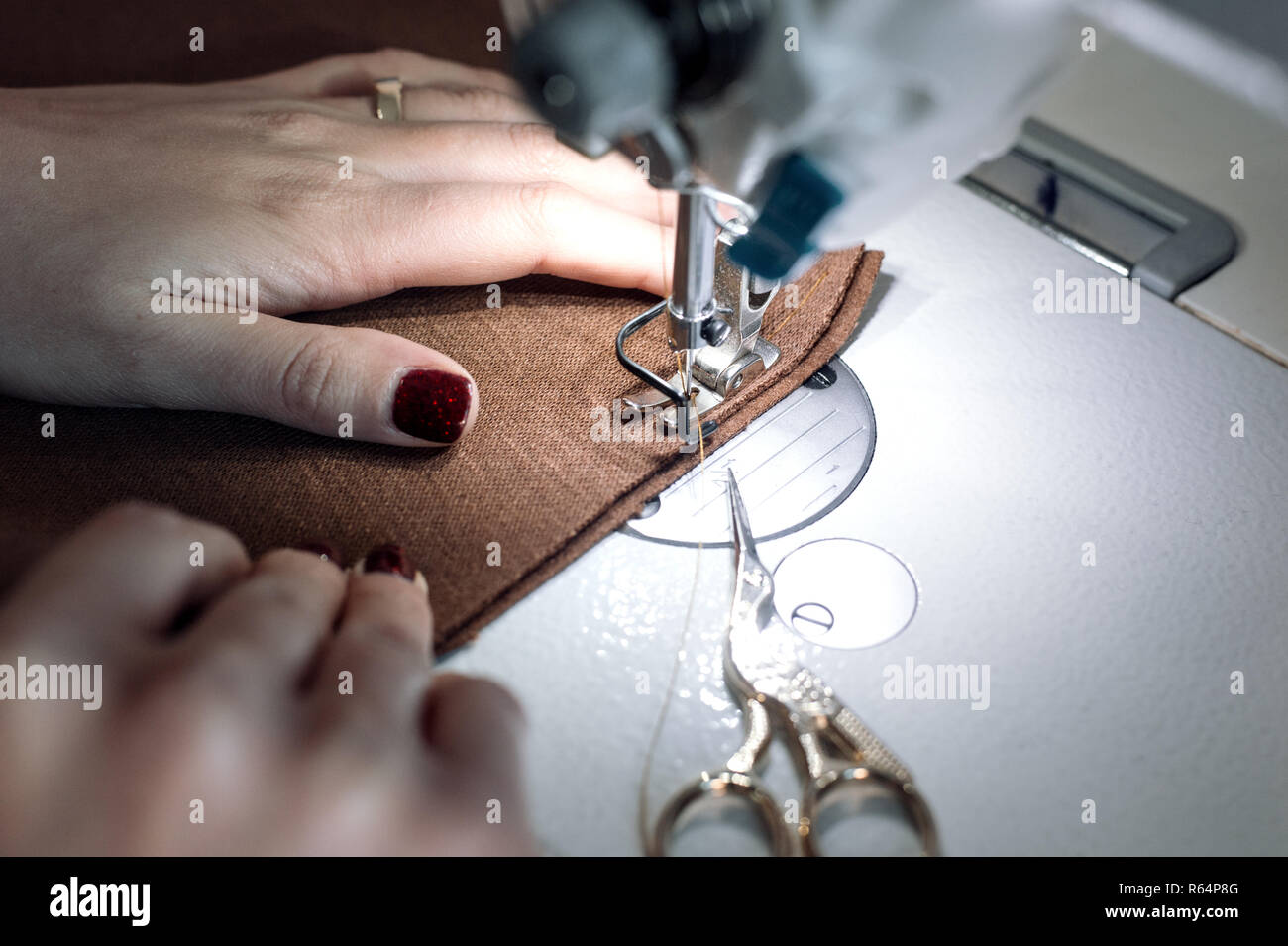 The sewing machine and item of clothing Stock Photo - Alamy
