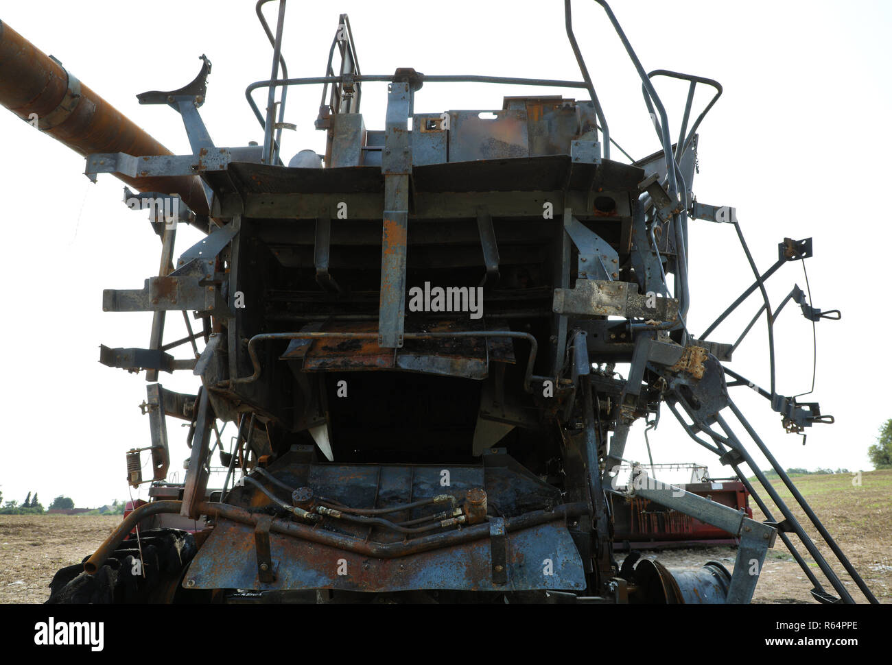 Combine harvester destroyed by fire Stock Photo - Alamy