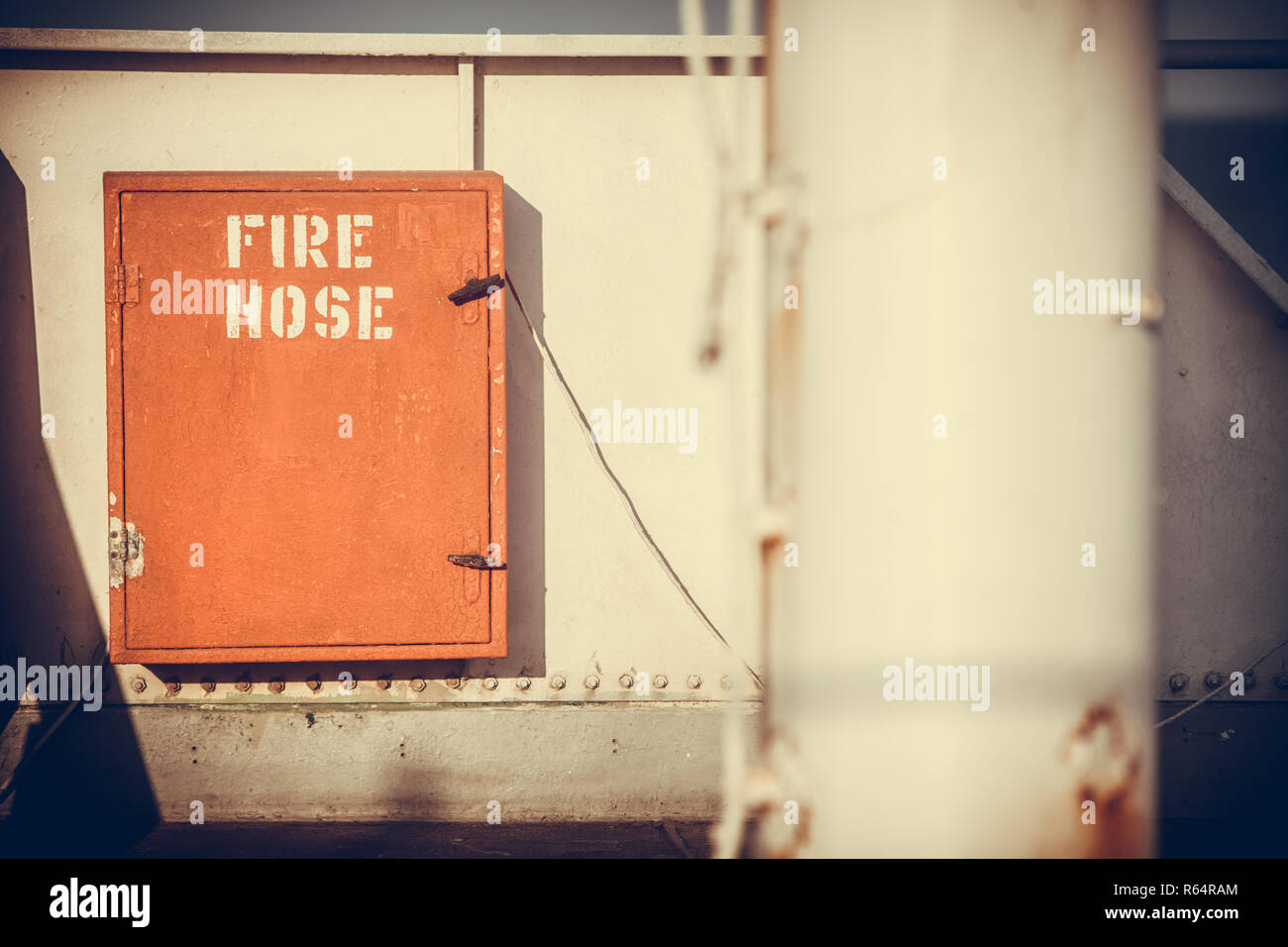 Fire hose on a ship Stock Photo - Alamy