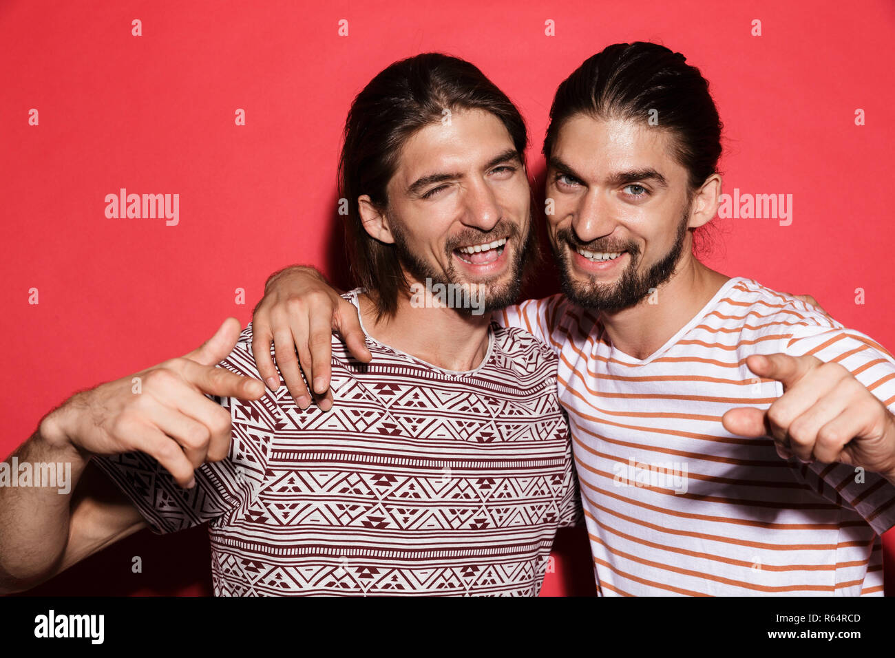 Two pointing men stand hi-res stock photography and images - Alamy