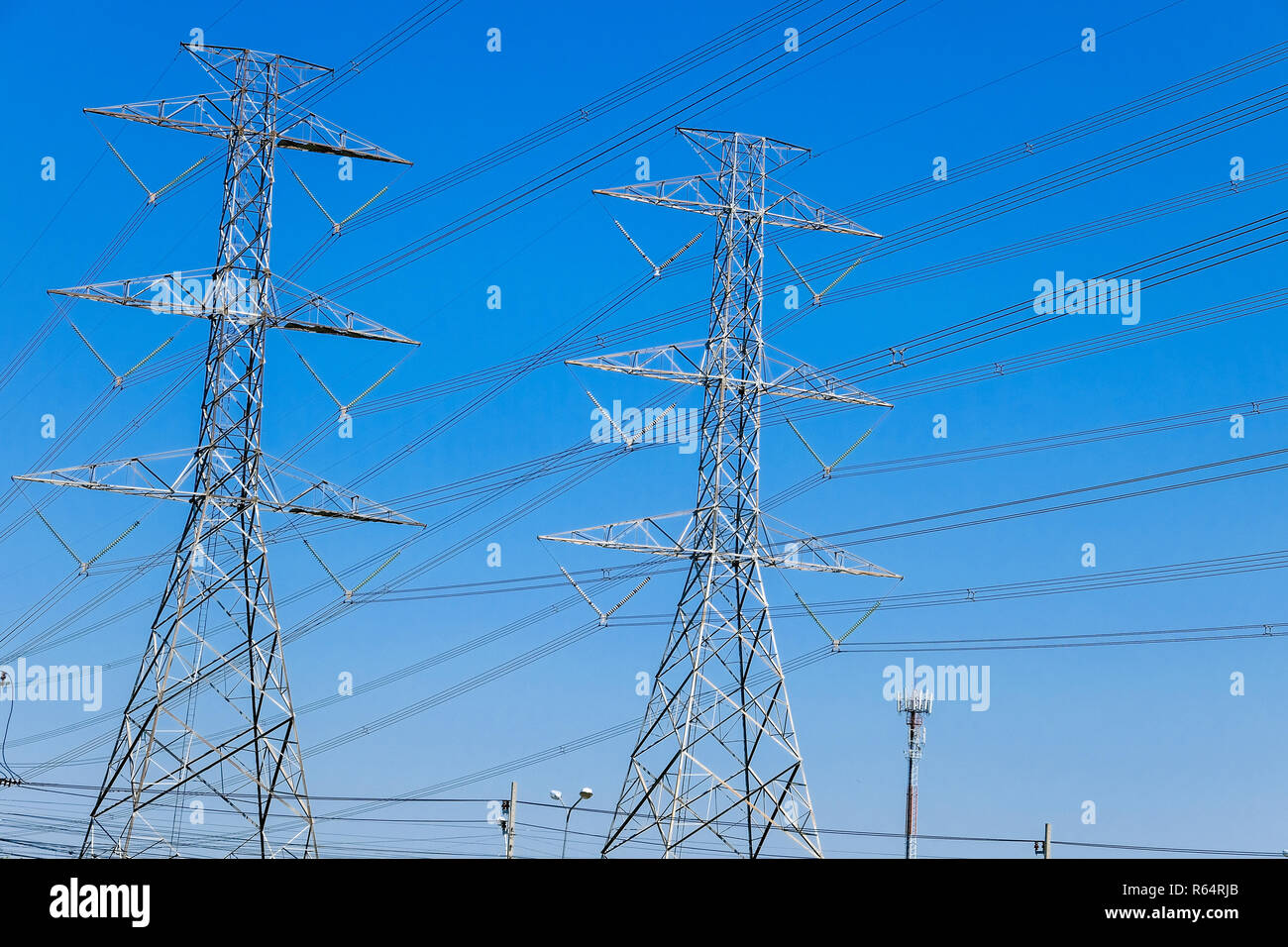 Electric Pylons background Stock Photo - Alamy