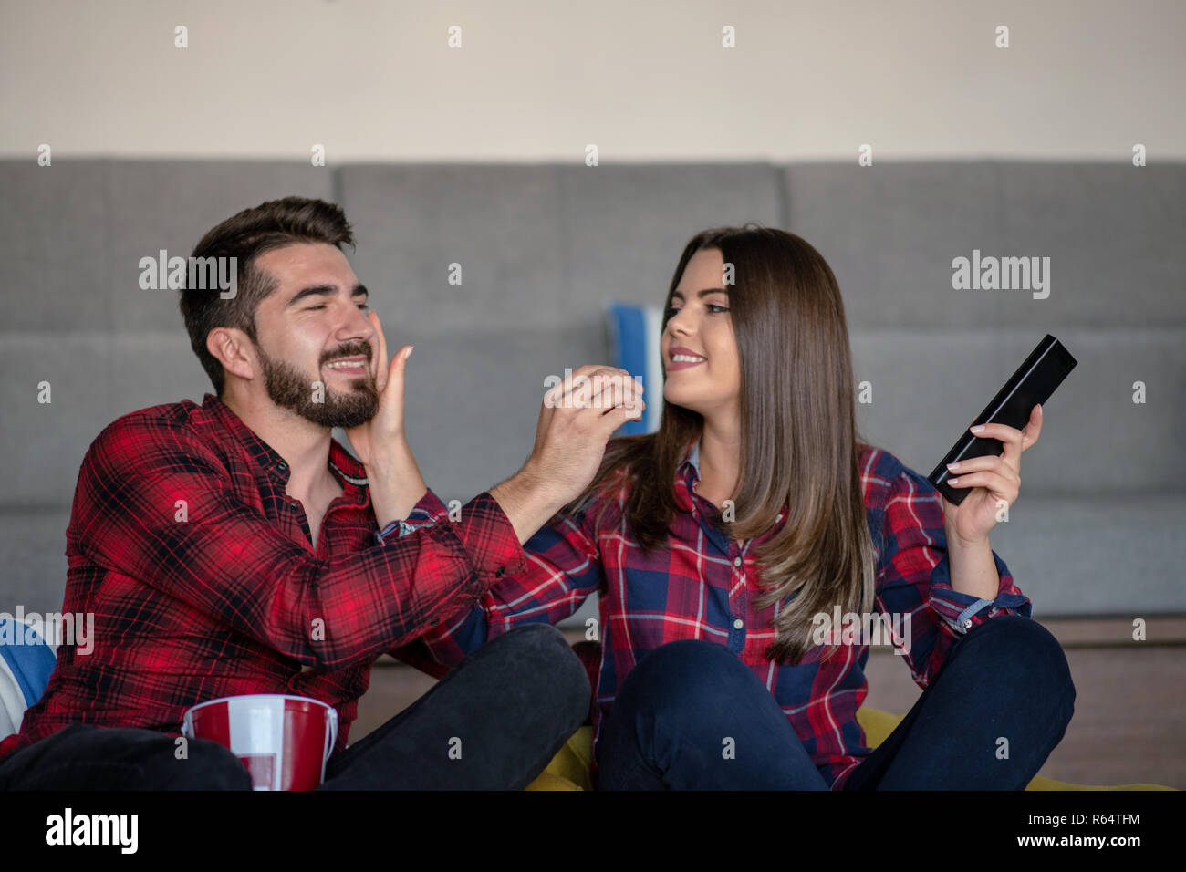 Fighting for the tv remote hi-res stock photography and images - Alamy