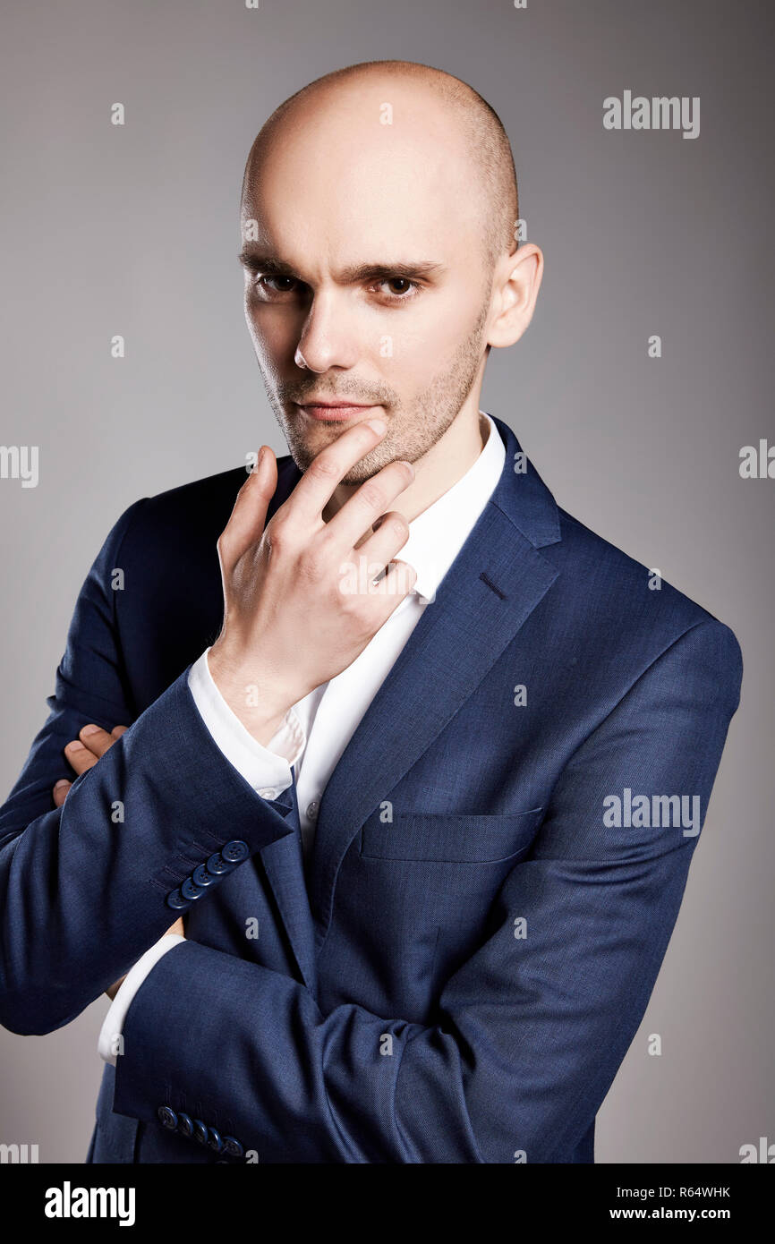 Pensive Man in Suit Stock Photo - Alamy