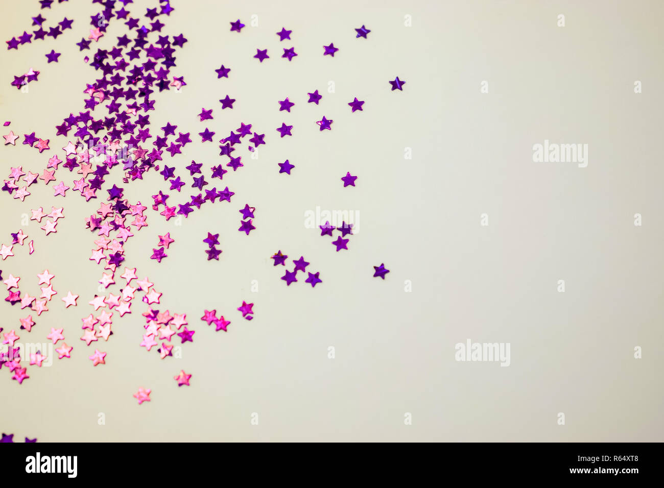 Purple glitter stars white background with copy space Stock Photo - Alamy