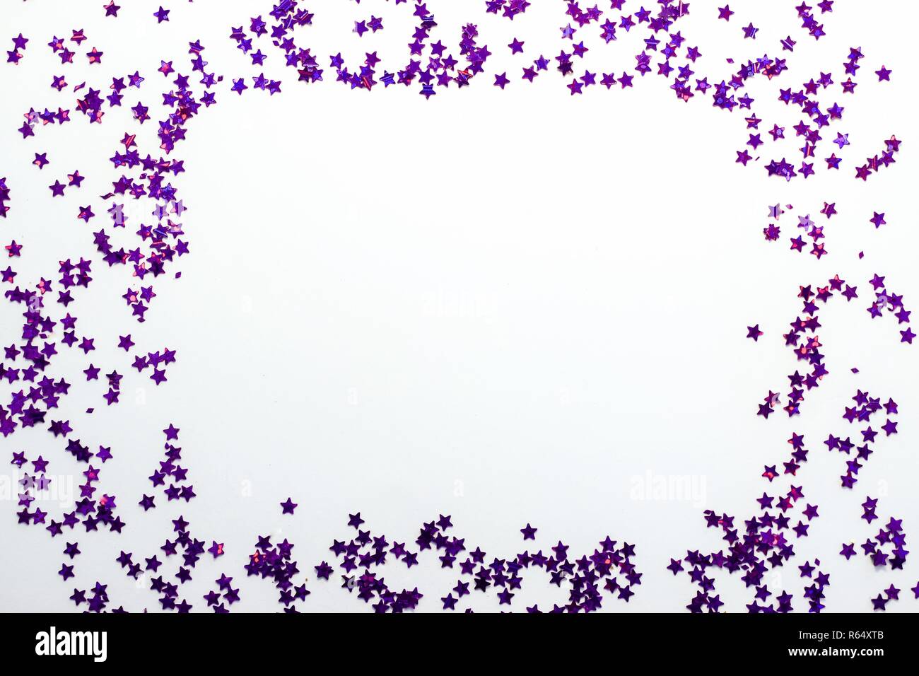 Purple glitter stars white background with copy space Stock Photo - Alamy