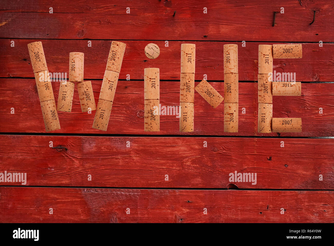 Word wine shaped by corks over red wood Stock Photo - Alamy