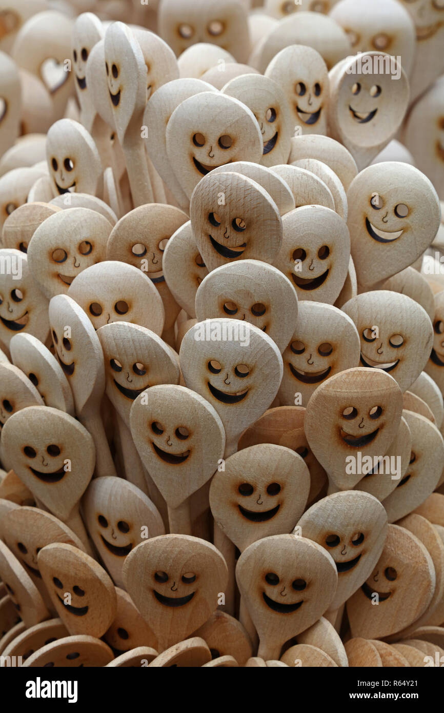 Wooden cooking spoons with smiling face carved Stock Photo - Alamy