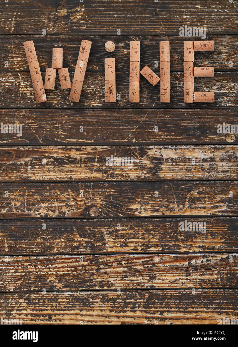 Word wine shaped by corks over dark vintage wood Stock Photo - Alamy