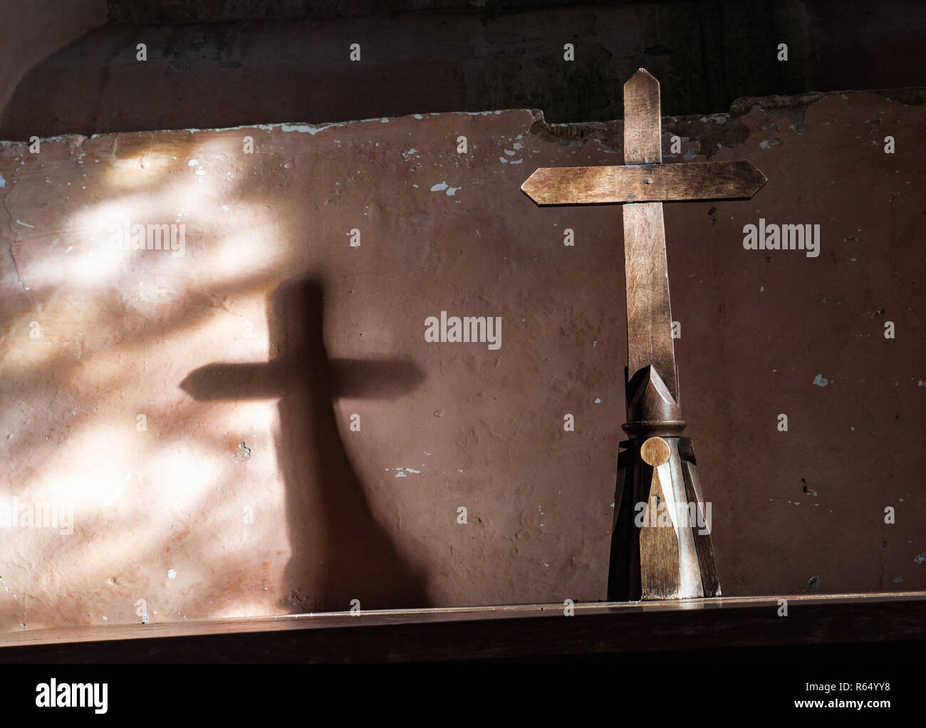 Wooden Crucifix and casted shadow Stock Photo - Alamy