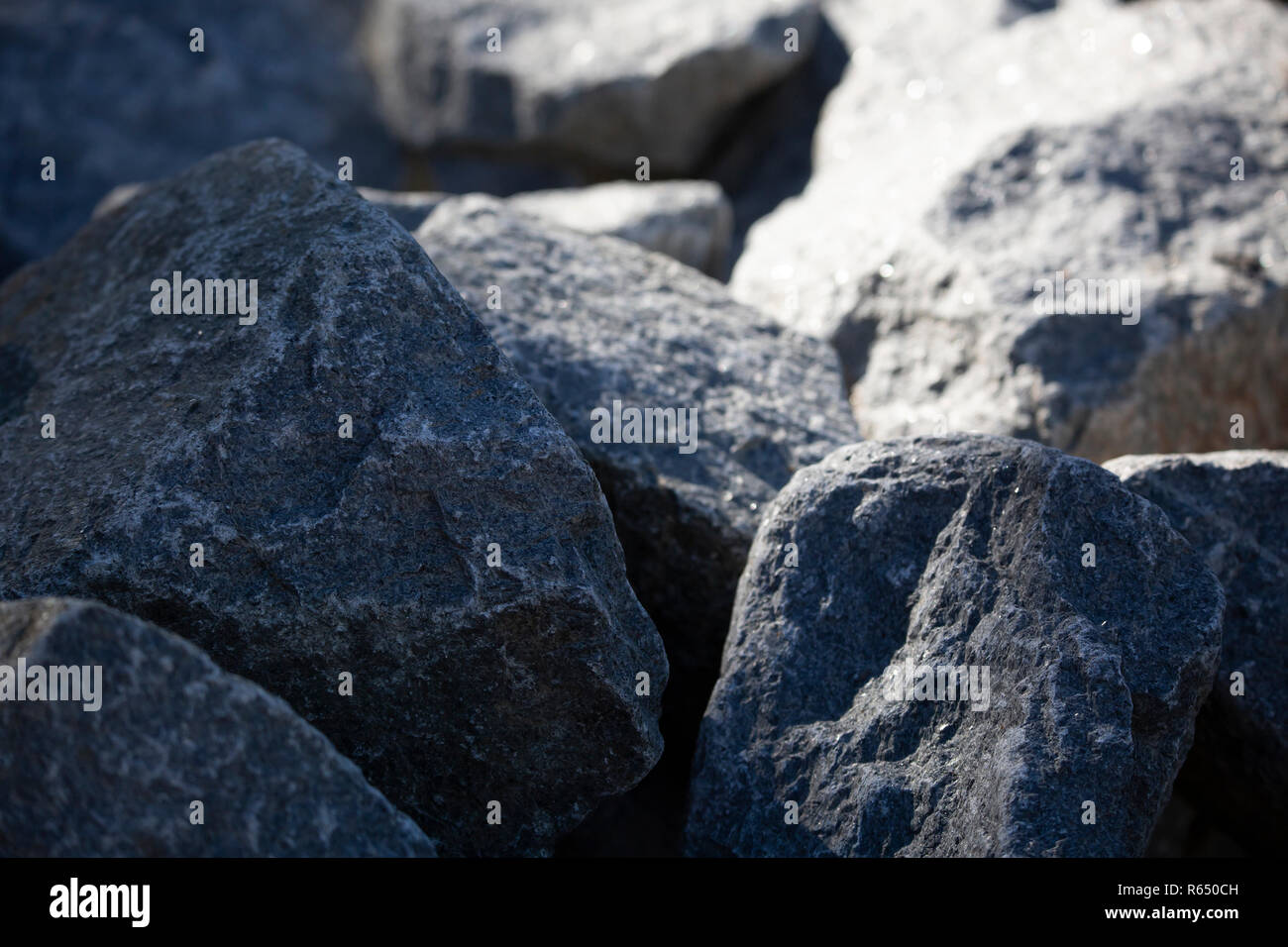 Close up of large, sparkly grey granite rocks Stock Photo - Alamy