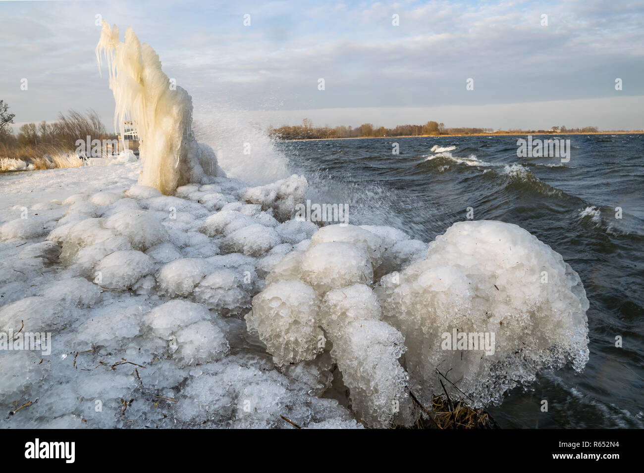 Bizarre ice forms and sculptures on the shore of a dutch lake. They are ...
