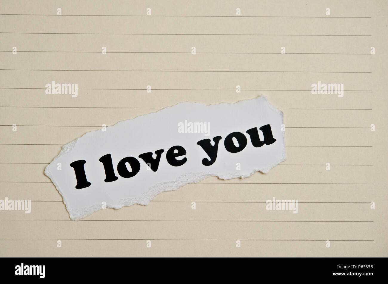words I LOVE YOU on a ripped piece paper Stock Photo - Alamy
