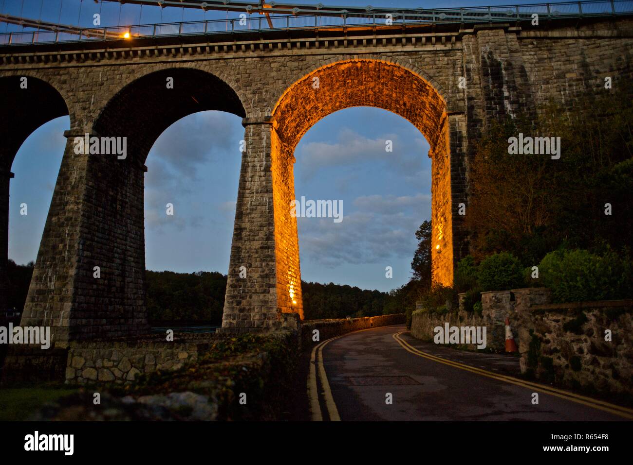 Limestone arches and columns of Menai Suspension Bridge at dawn, Menai ...