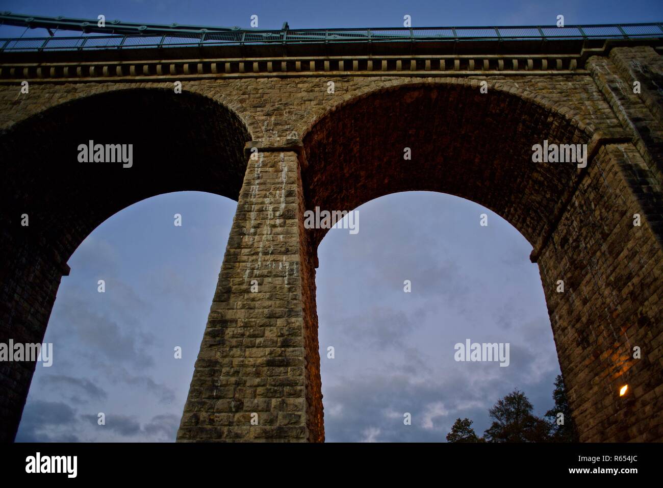 Limestone arches and columns of Menai Suspension Bridge at dawn, Menai ...