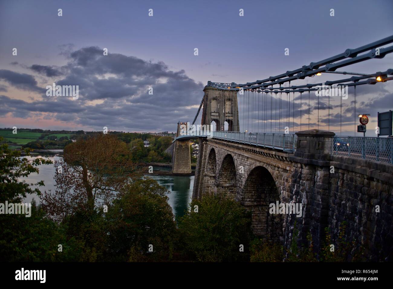 Menai Suspension Bridge viewed from Bangor, Gwynedd, Wales, UK dawn ...