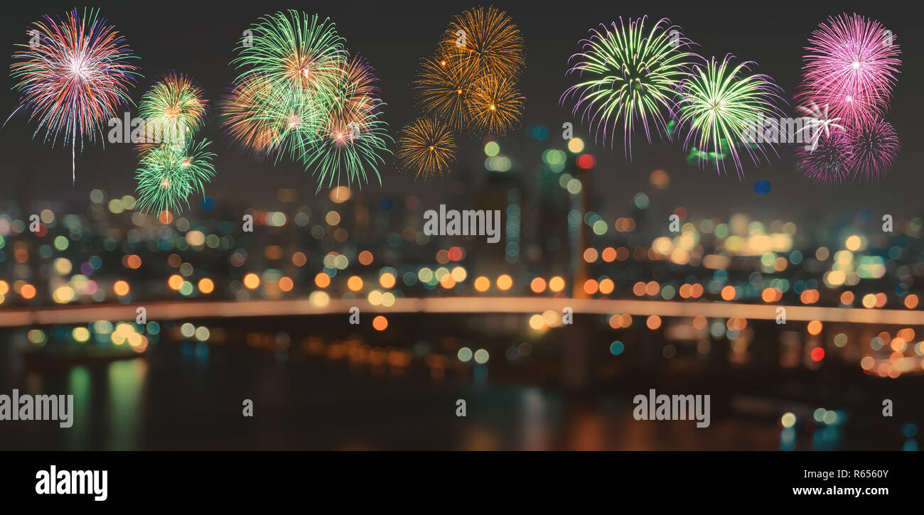Colorful fireworks on blurred bokeh city night lights background Stock ...