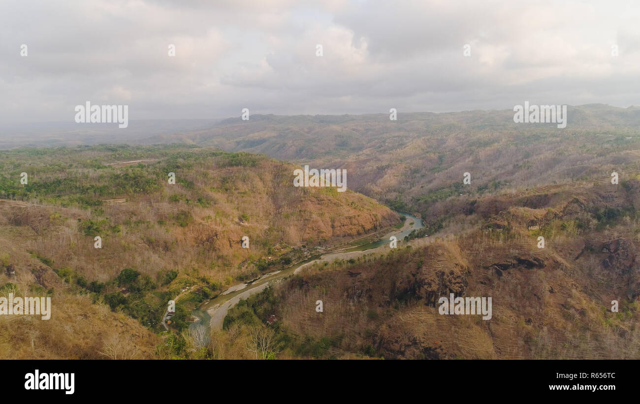aerial view river Oyo canyon among farm lands rice terraces. river in ...