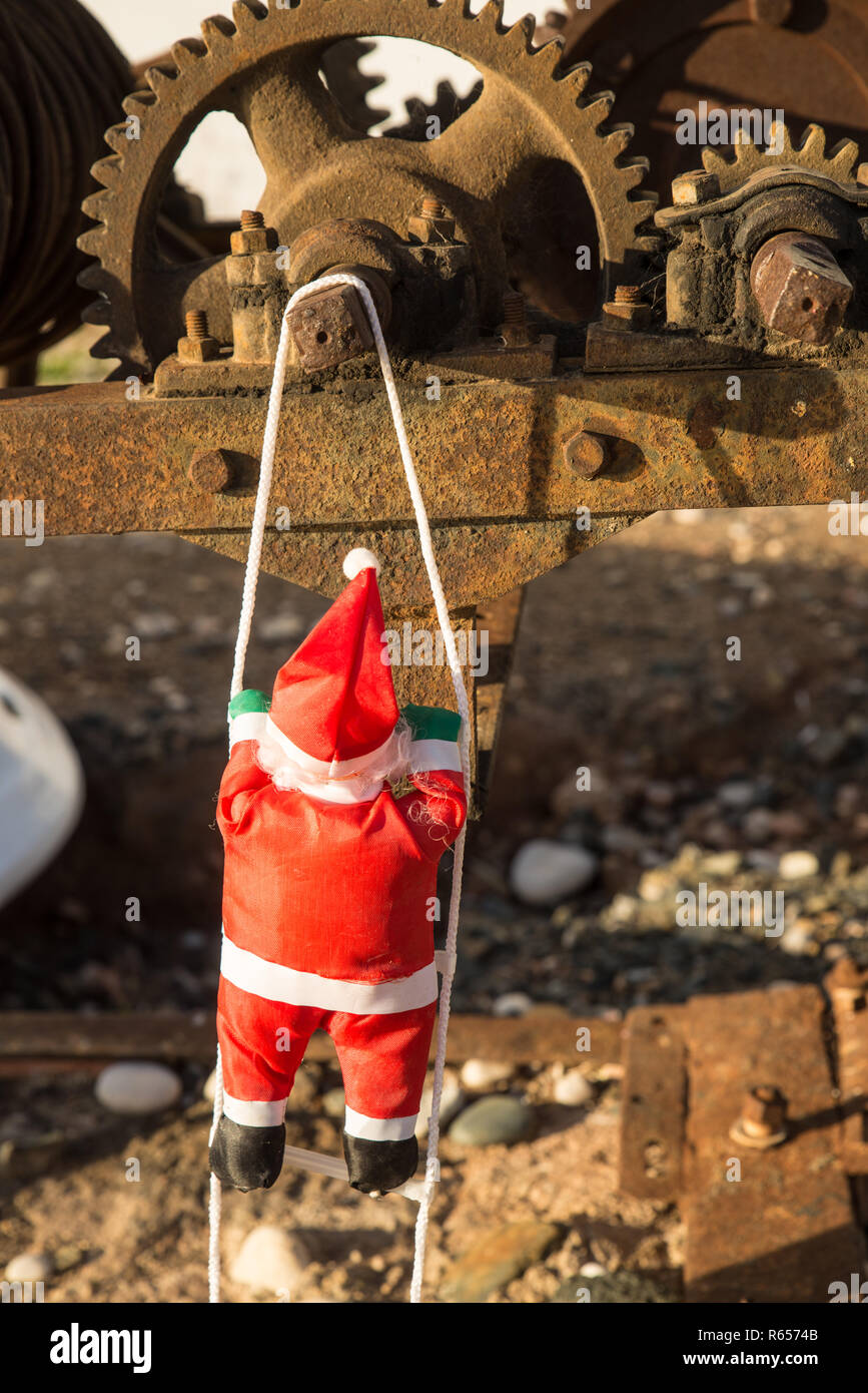 Santa in the cogwheels of consumerism, a concept Stock Photo - Alamy