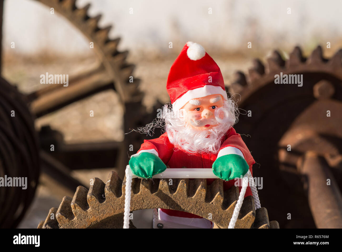Santa in the cogwheels of consumerism, a concept Stock Photo - Alamy