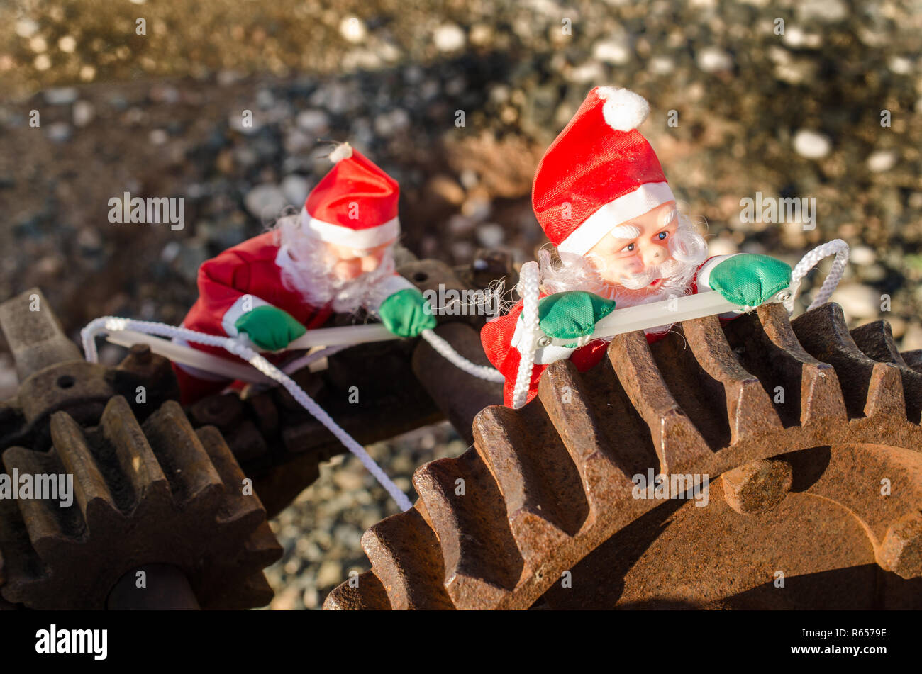 Santa in the cogwheels of consumerism, a concept Stock Photo - Alamy