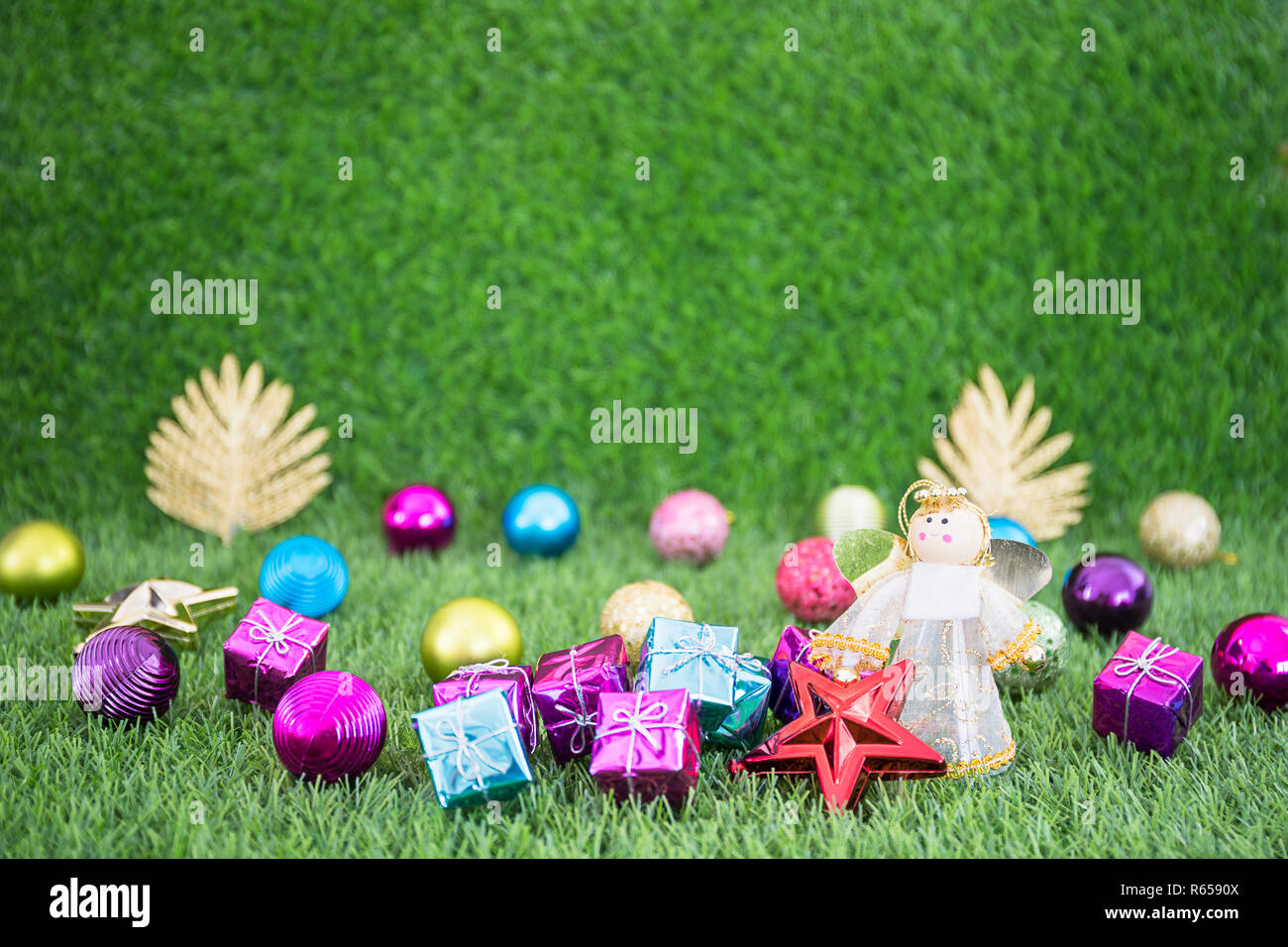 Christmas decoration on grass with copy space Stock Photo - Alamy