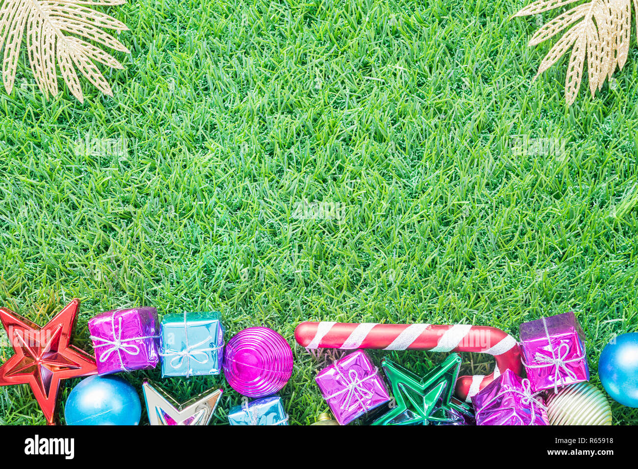 Christmas decoration on green grass with copy space Stock Photo - Alamy