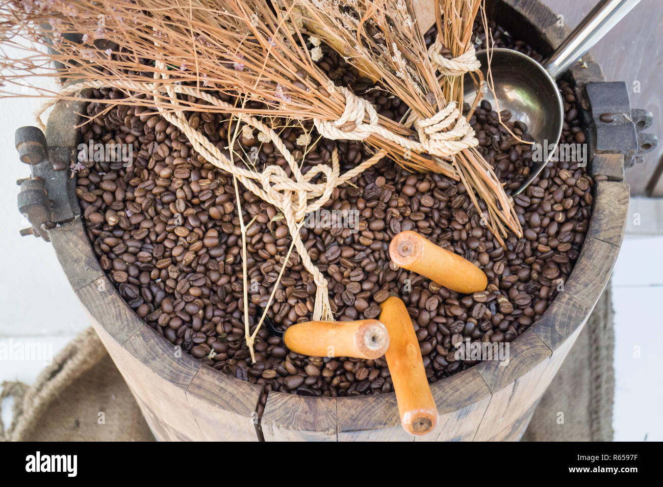 Roasted coffee bean in wood bucket Stock Photo - Alamy